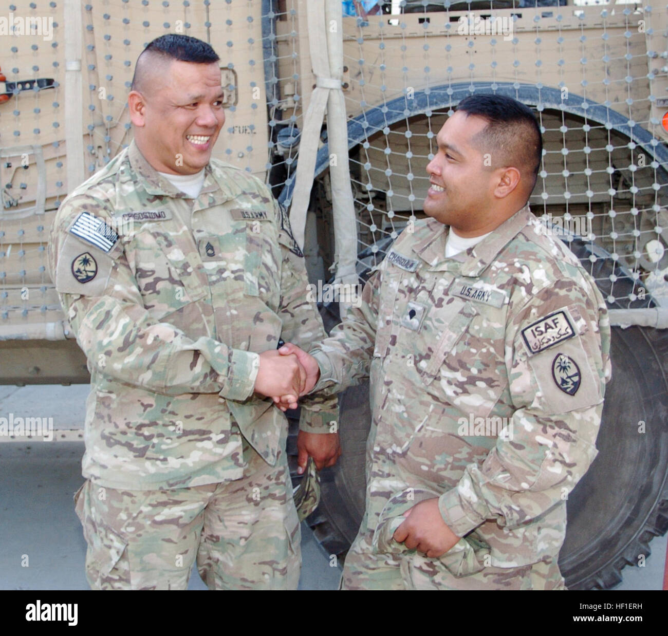 Sgt. 1st Class Peter Crisostomo, left, and Spc. John F. Chargualaf ...