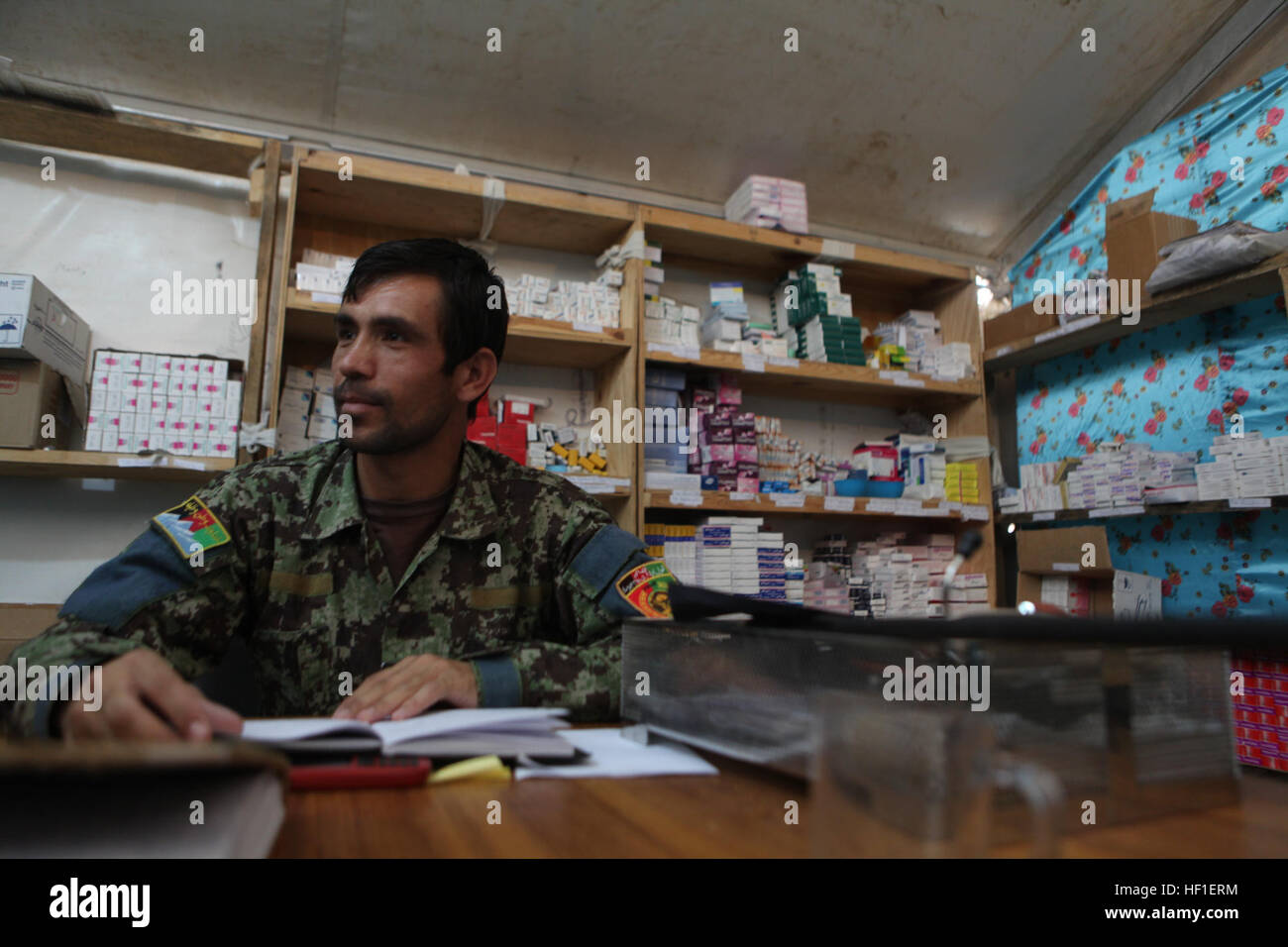An Afghan National Army medical soldier discusses pharmaceutical ...