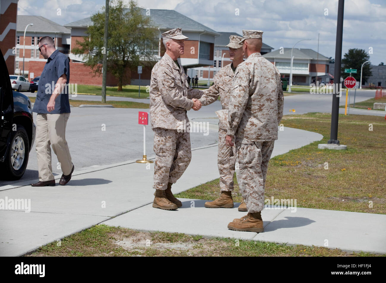 Commandant of the Marine Corps Gen. James F. Amos shakes hands with Col ...