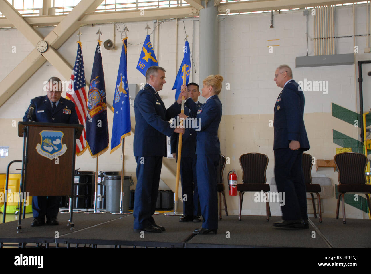 Col. John Higgins, the commander of the 107th Airlift Wing hands the ...