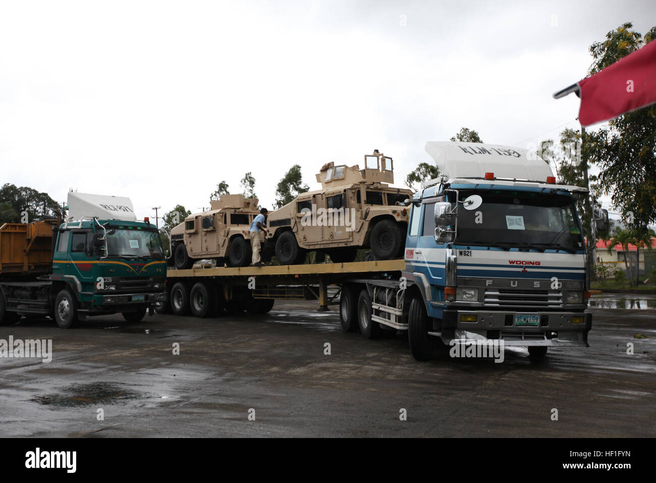 Richard Bahena, a transport company employee, helps load U.S. Marine ...