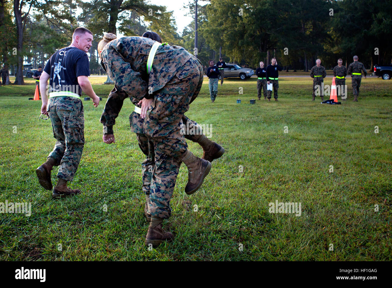 A female student with Infantry Training Battalion carries another ...