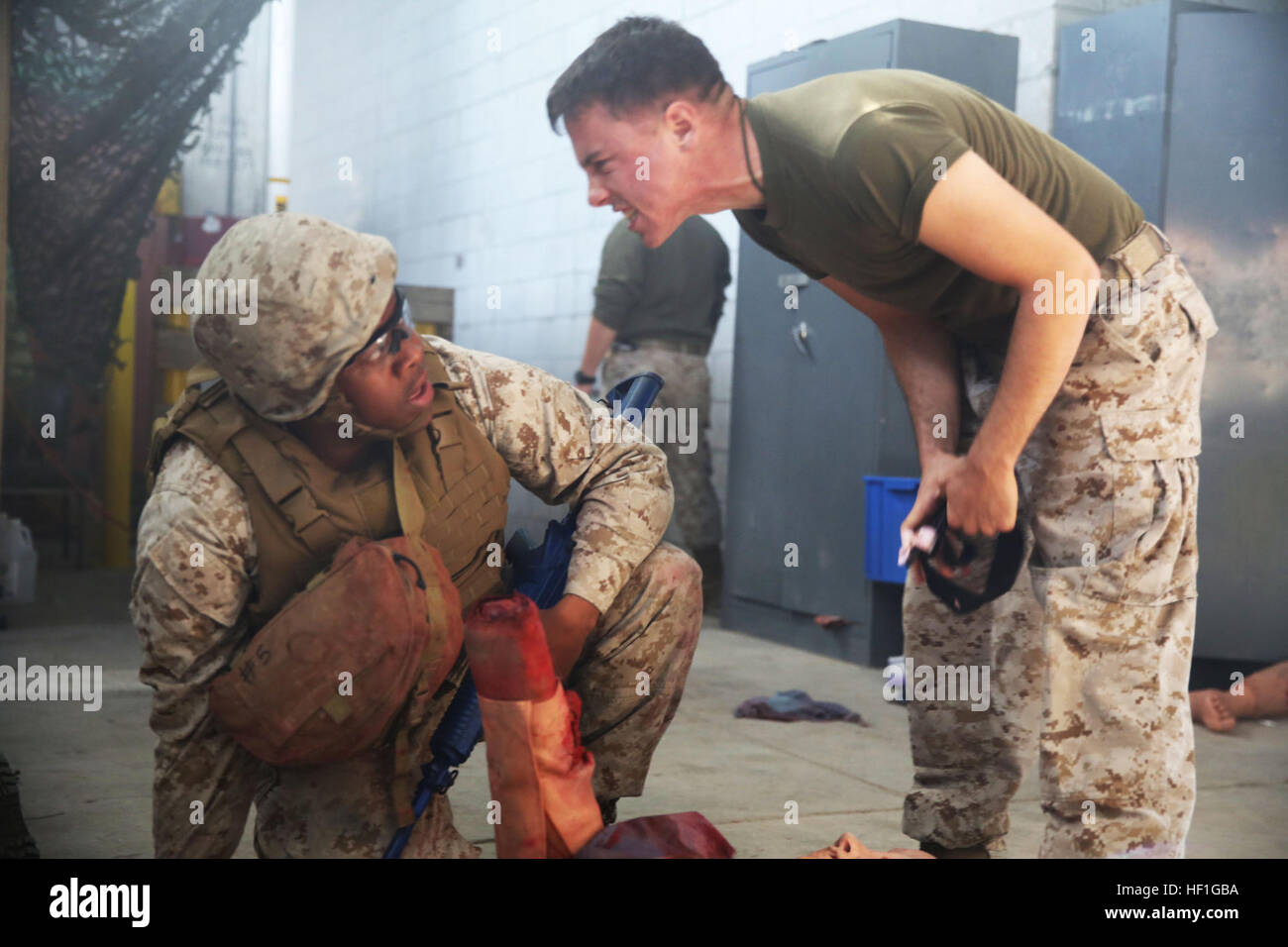 Petty Officer Third Class Joshua O'Hara (right) yells at a student ...