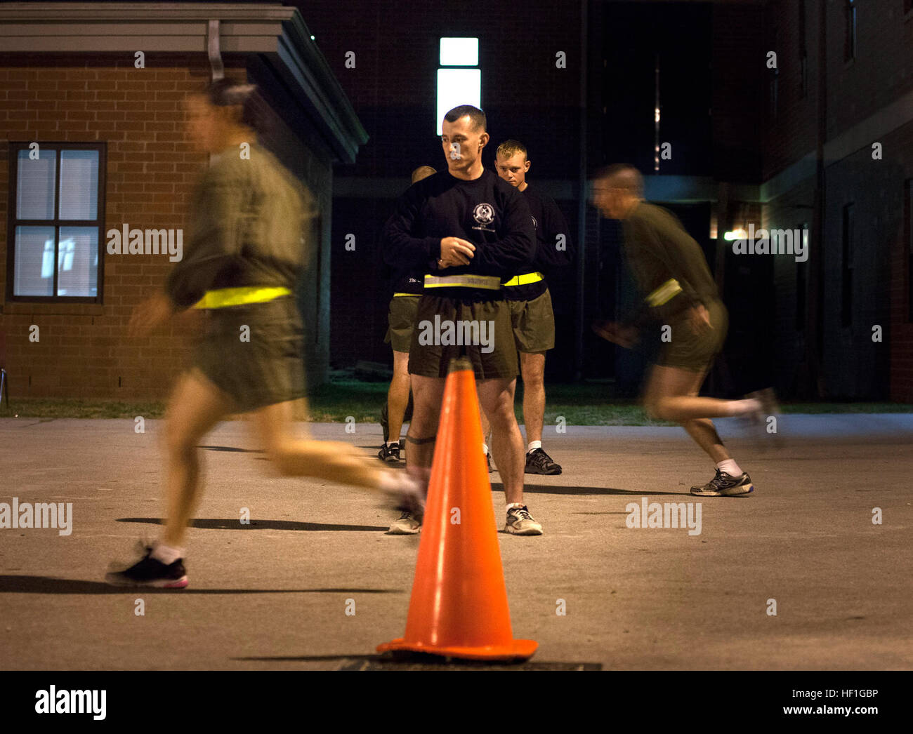 A combat instructor at the Infantry Training Battalion times a female ...