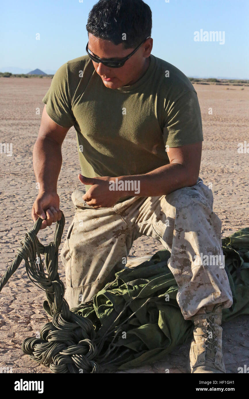 Lance Cpl. David Meneses, a parachute rigger with Air Delivery Platoon ...
