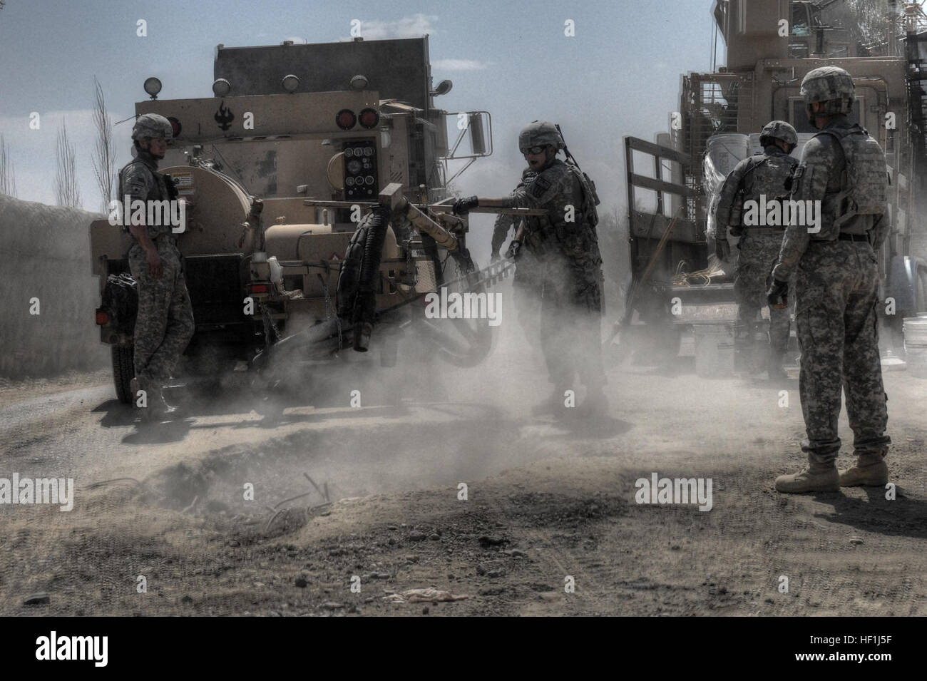 U.S. Army Sapper Company engineers patch a road in Khowst province ...