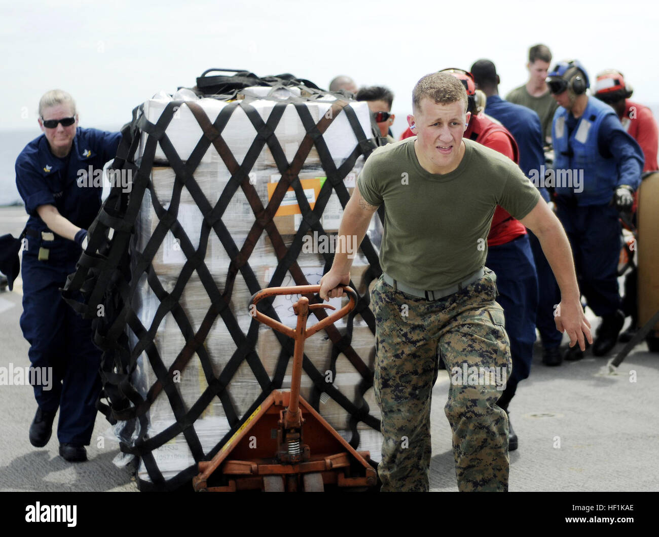 Sailors and Marines aboard U.S. 7th Fleet command flagship USS Blue ...