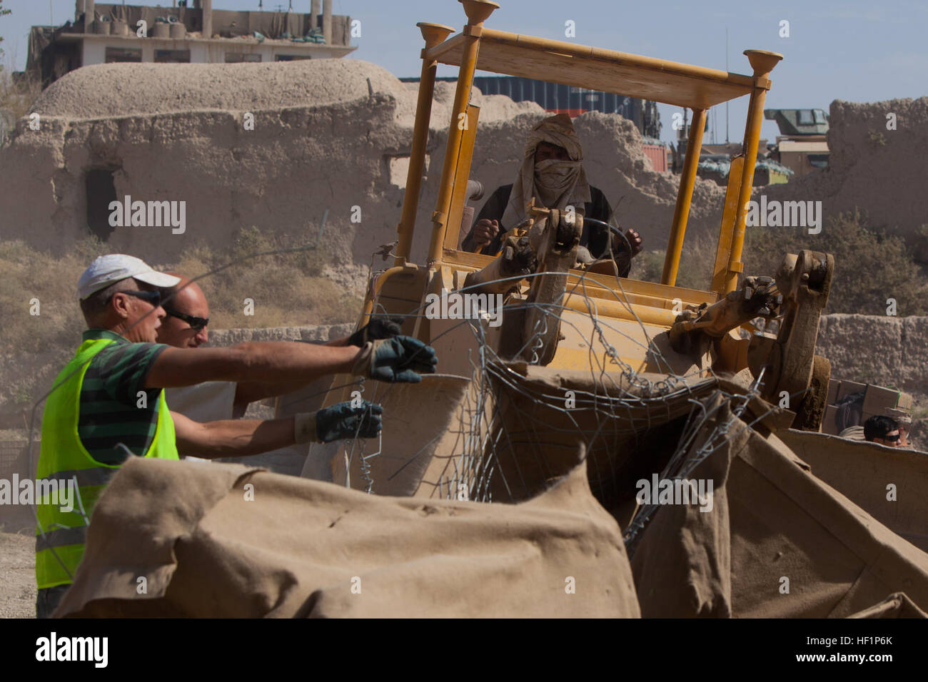 Contractors tear down HESCO barriers at Forward Operating Base Musa ...