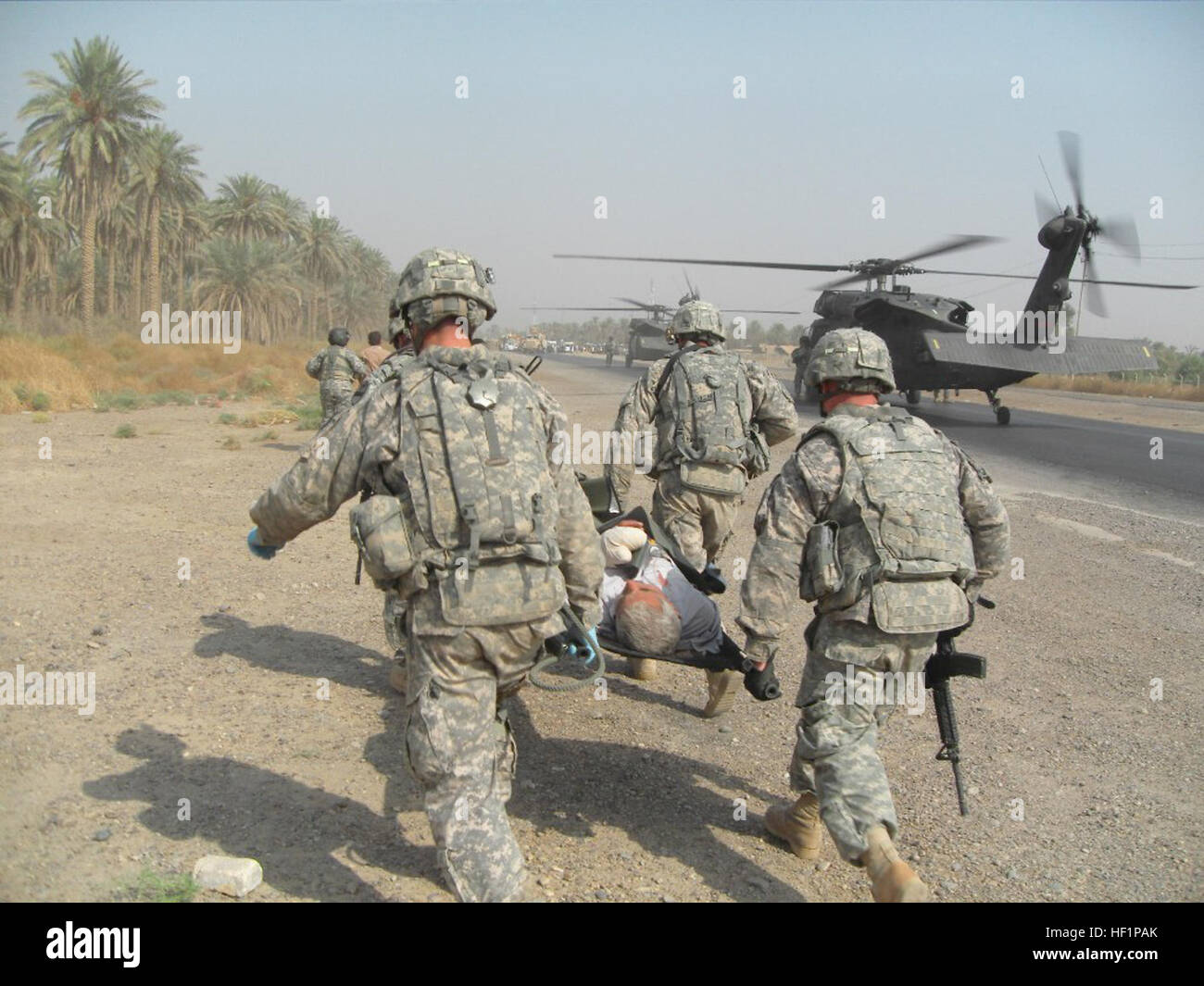 Soldiers of Company B, 1st Battalion, 5th Cavalry Regiment, rush an ...