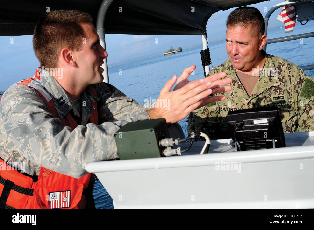 Coast Guard Chief Petty Officer Scott Duckworth, right, chief of ...