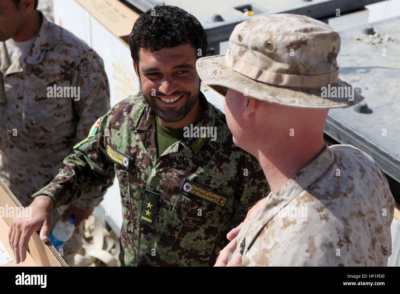 U.S. Navy Chief Petty Officer Derrick Hurt, right, a Class VIII adviser ...
