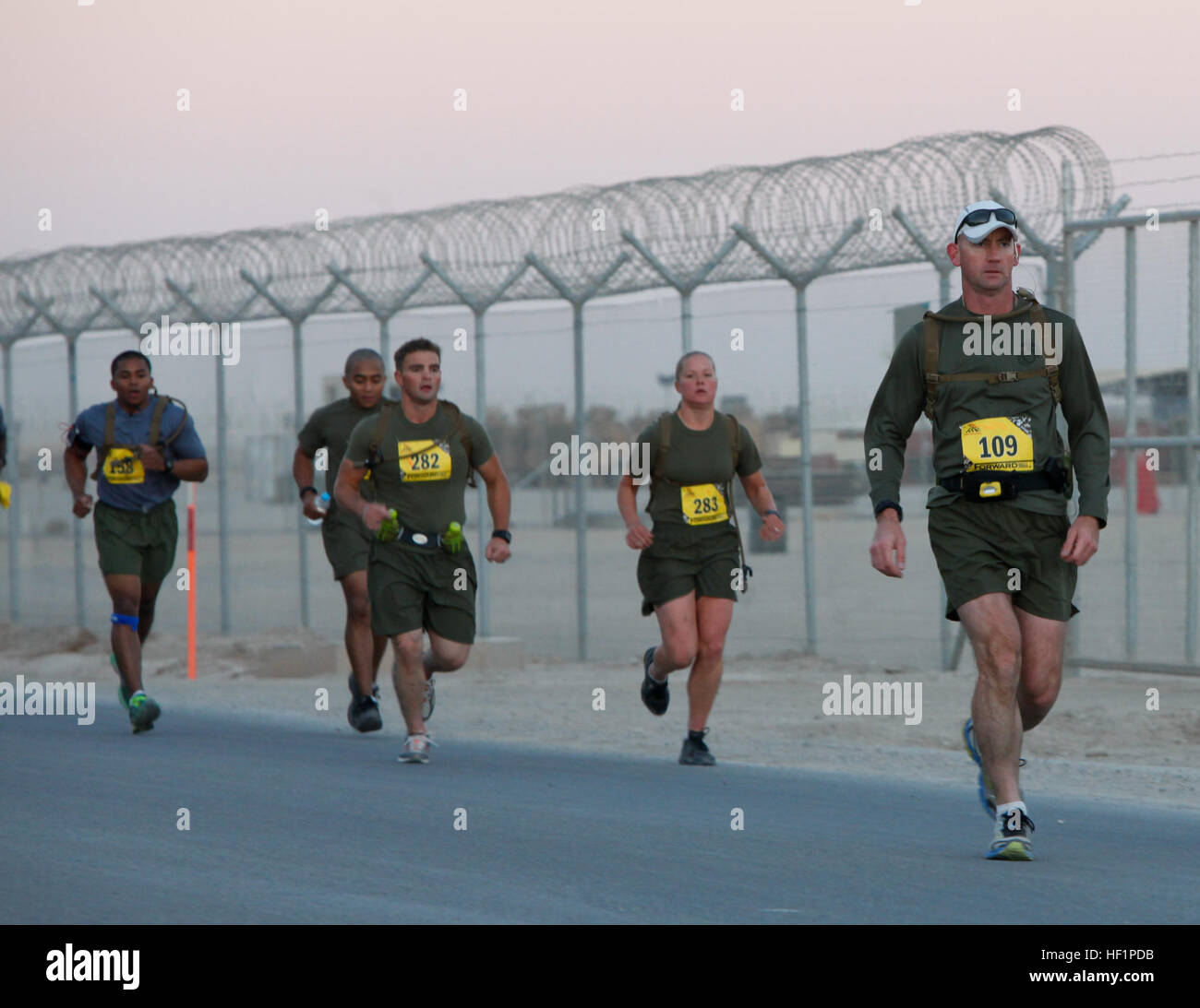 Runners compete in the 2013 Marine Corps Marathon Forward at Camp ...