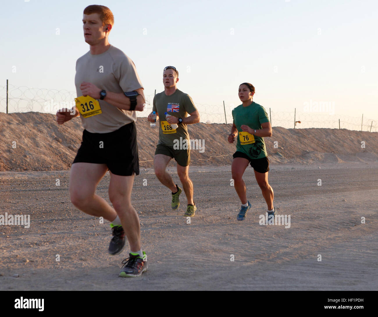 Runners compete in the 2013 Marine Corps Marathon Forward at Camp ...