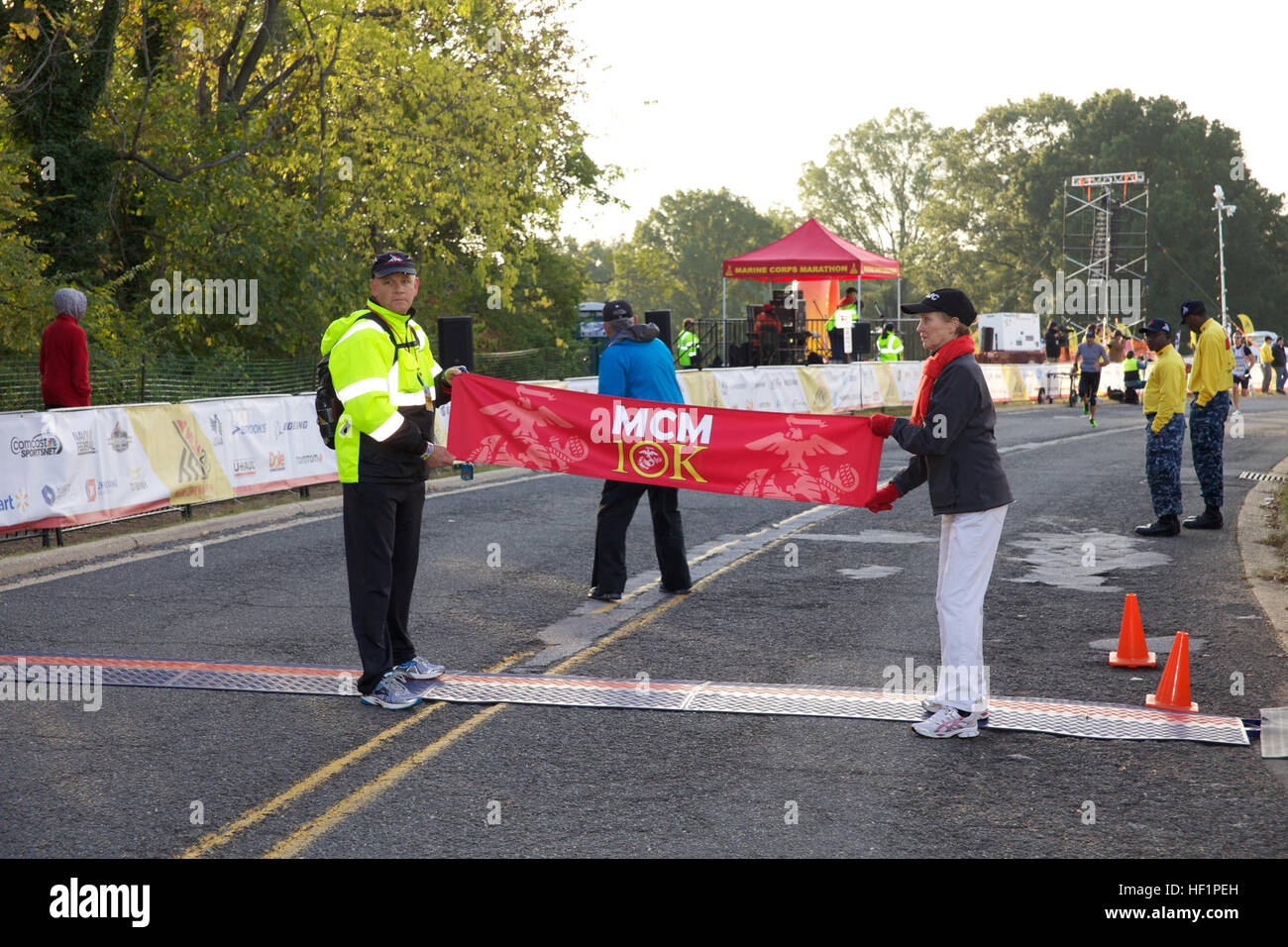 The First Lady of the Marine Corps, Bonnie Amos, right, holds the 10K ...