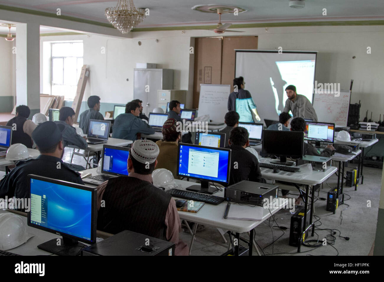 Members of the Afghanistan Uniformed Police participate in a computer ...