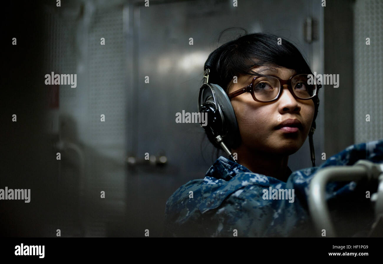 Seaman Mafe Sabar mans a sound-powered telephone inside the aft ...
