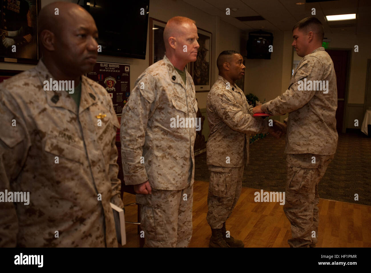 Sergeant Maj. Steven E. Collier presents a certificate of completion to ...