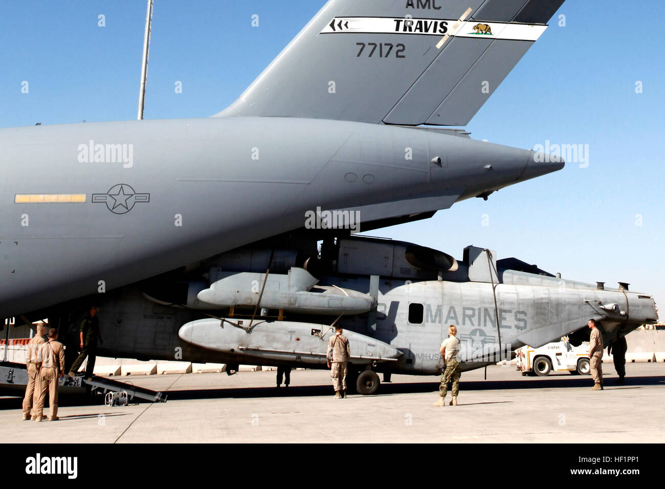 U.S. Marines with Marine Heavy Helicopter Squadron 462 (HMH-462) load a ...