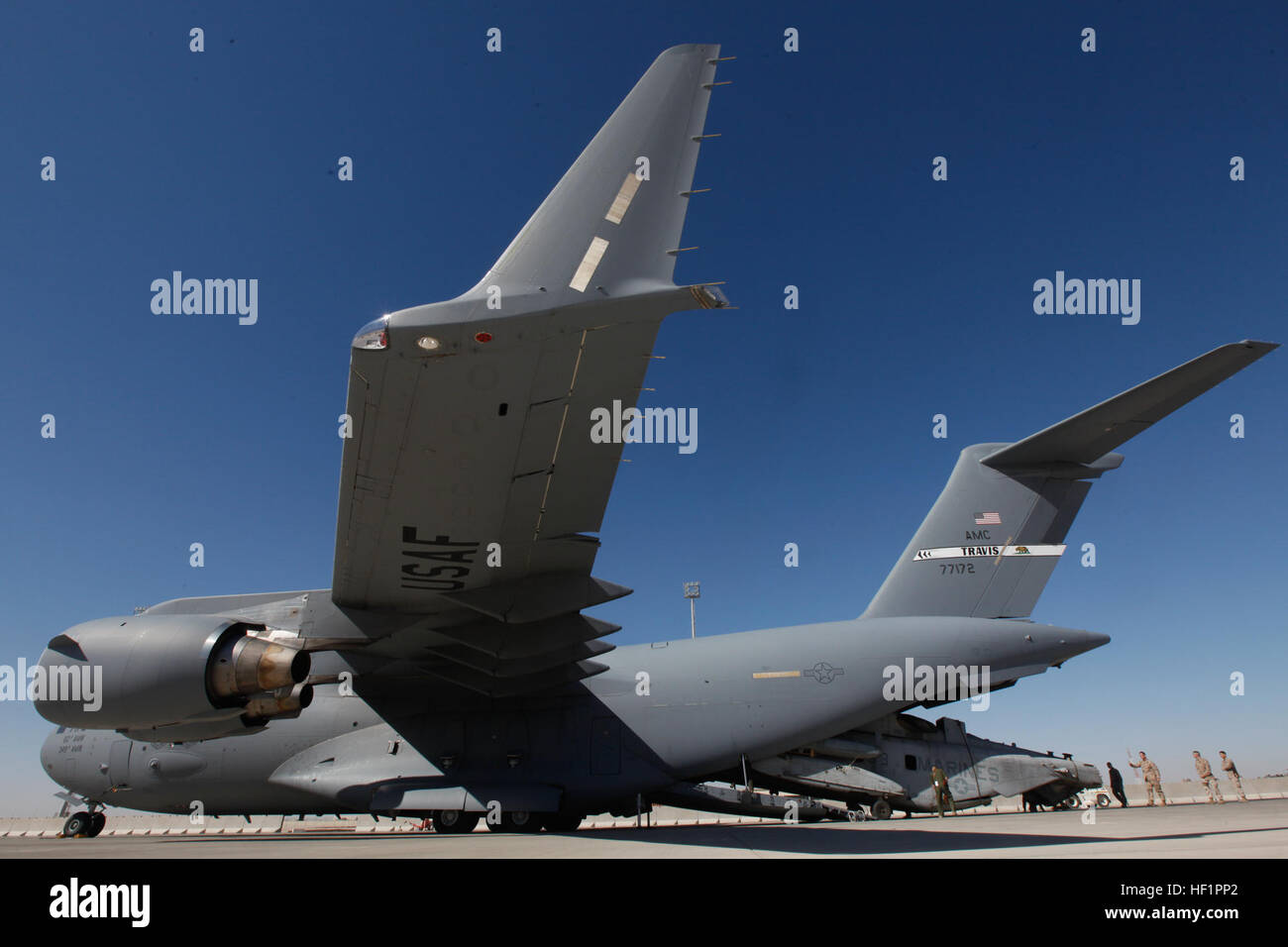 U.S. Marines with Marine Heavy Helicopter Squadron 462 (HMH-462) load a ...