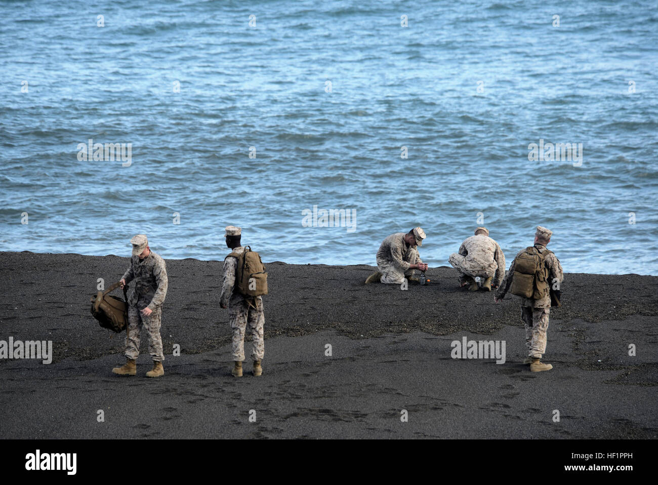 Marines with MWHS-1 gather sand on the beaches of Iwo To Nov. 1 during ...