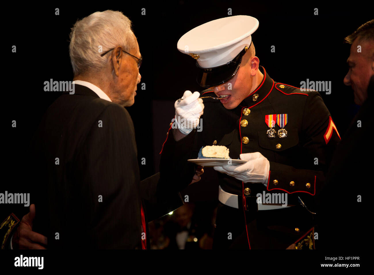 Pfc. Kris Van Flein, right, eats a piece of cake presented by Pfc ...