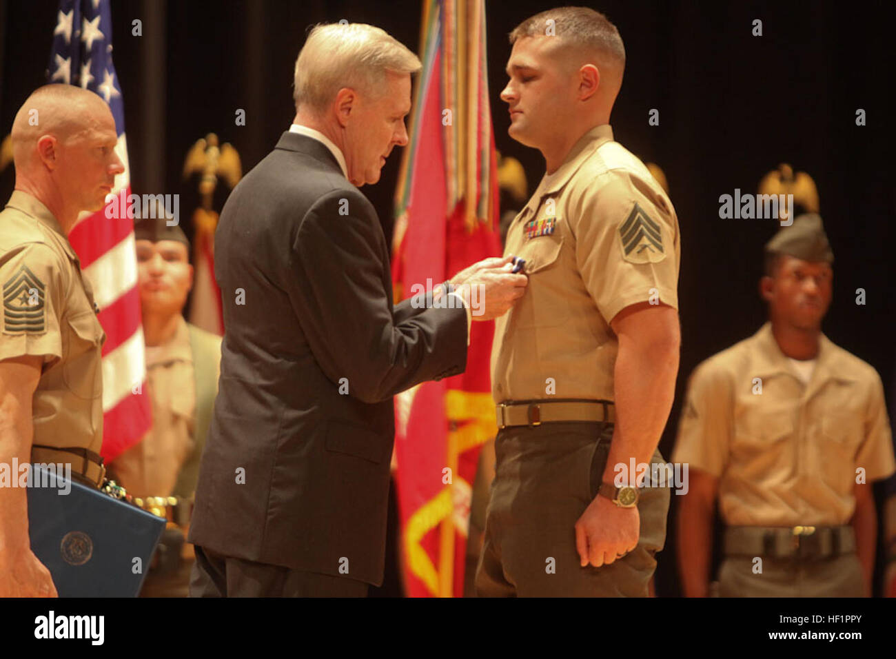Sergeant Joshua L. Moore is presented the Navy Cross from the Secretary ...