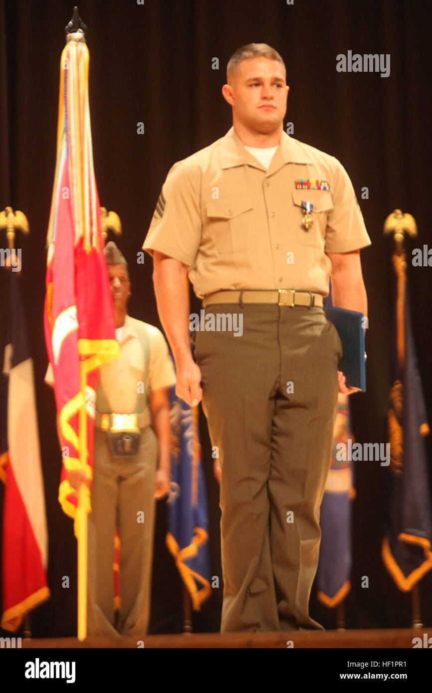 Sergeant Joshua L . Moore presents his Navy Cross to the audience after ...