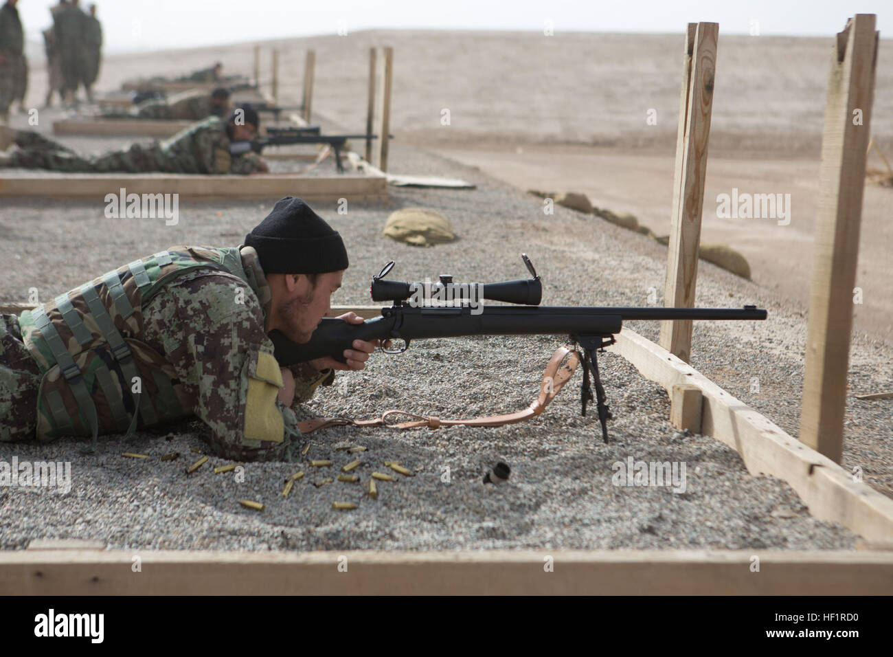 An Afghan National Army soldier with the 215th Corps fires a Remington ...