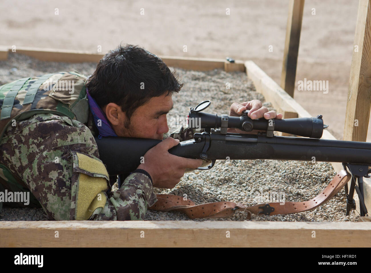 An Afghan National Army soldier with the 215th Corps fires a Remington ...