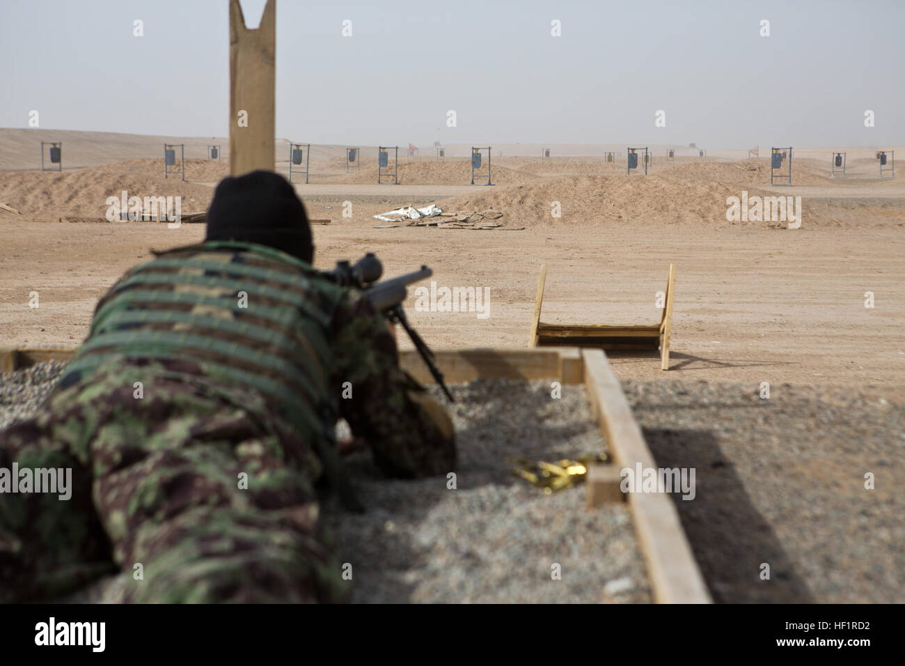 An Afghan National Army soldier with the 215th Corps fires a Remington ...