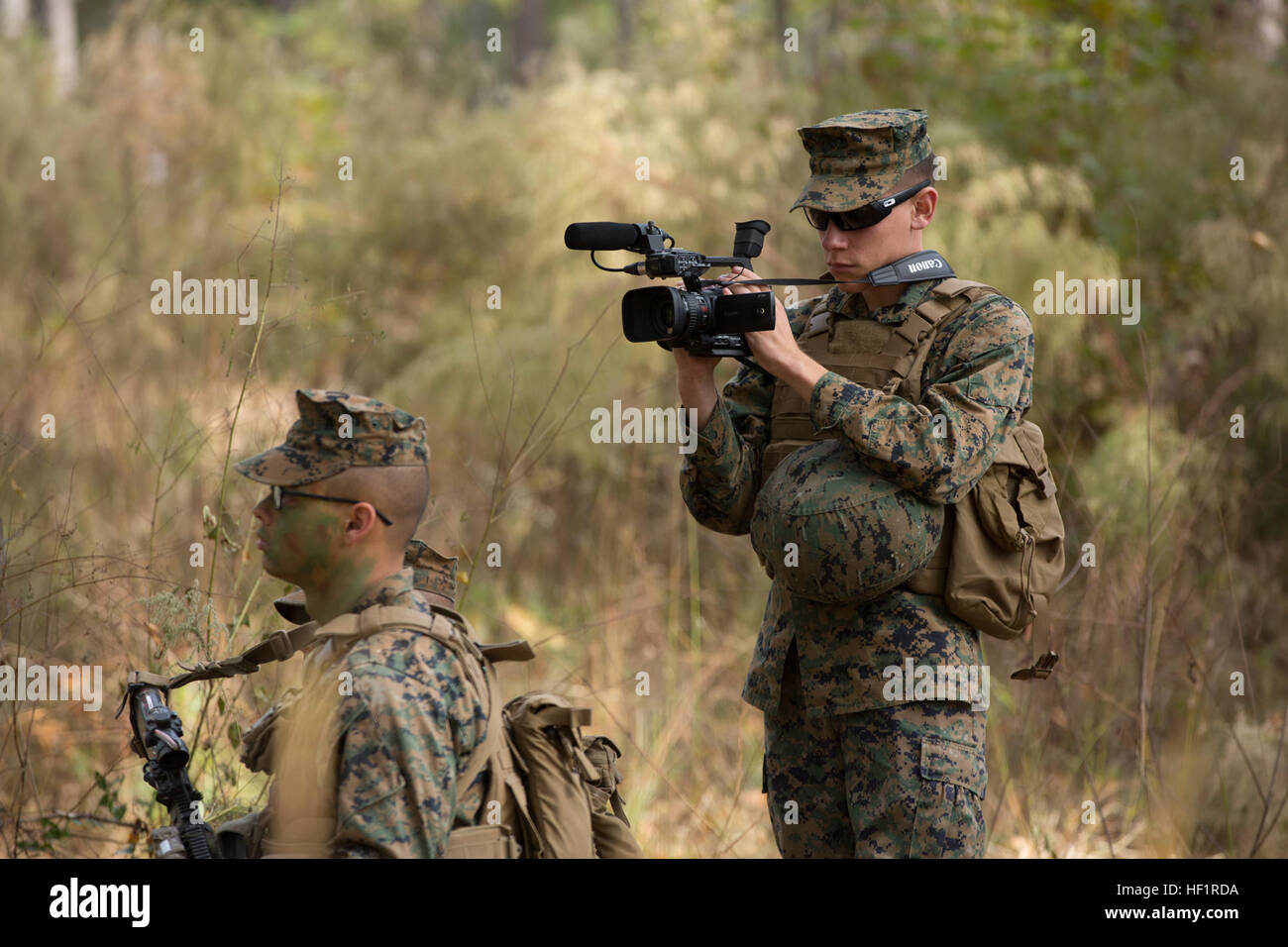 U.S. Marine Corporal Eric Moreno, a combat cameraman for the School of ...