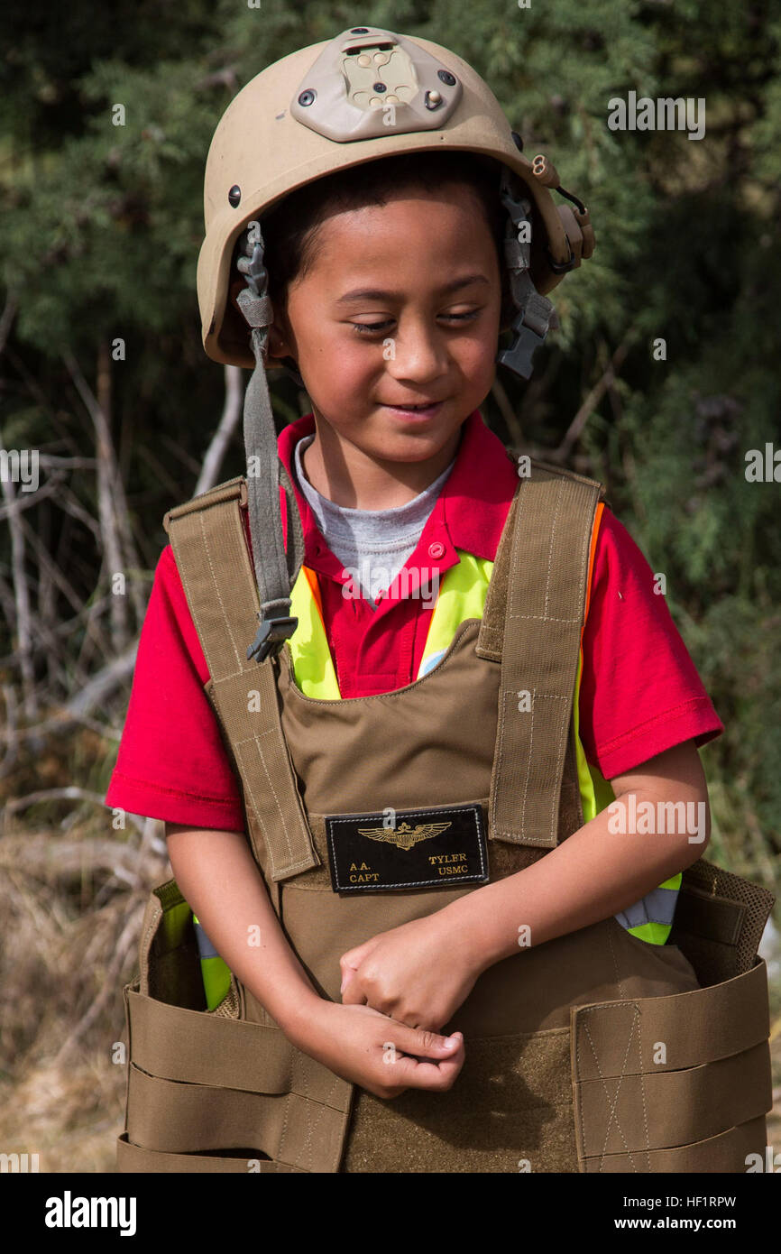 A Karaka Learning Centre preschool student tries on body armor and ...