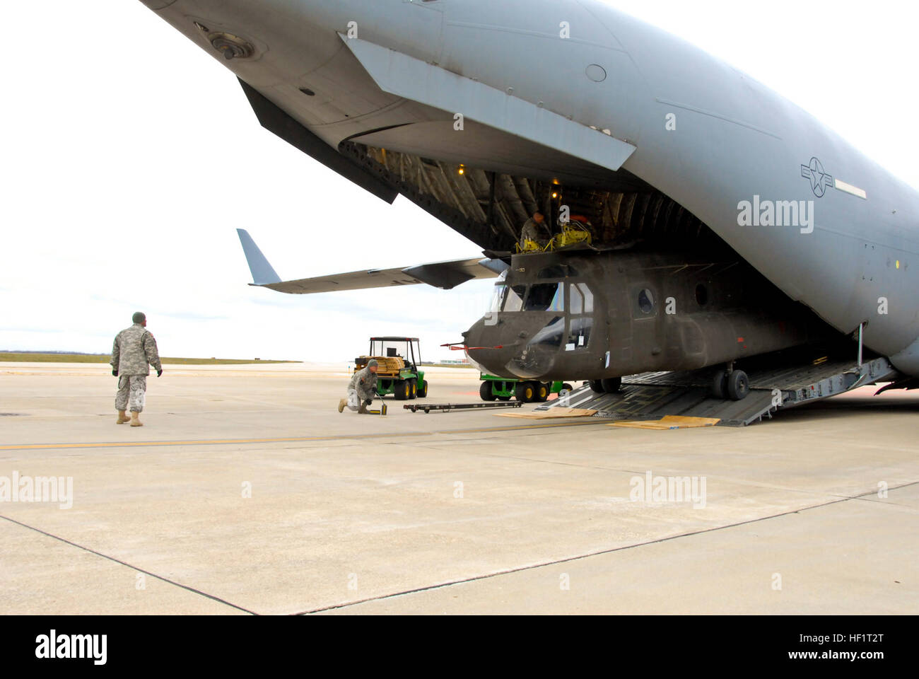 An Illinois Army National Guard CH-47 Chinook exits an Air Force C-17 ...