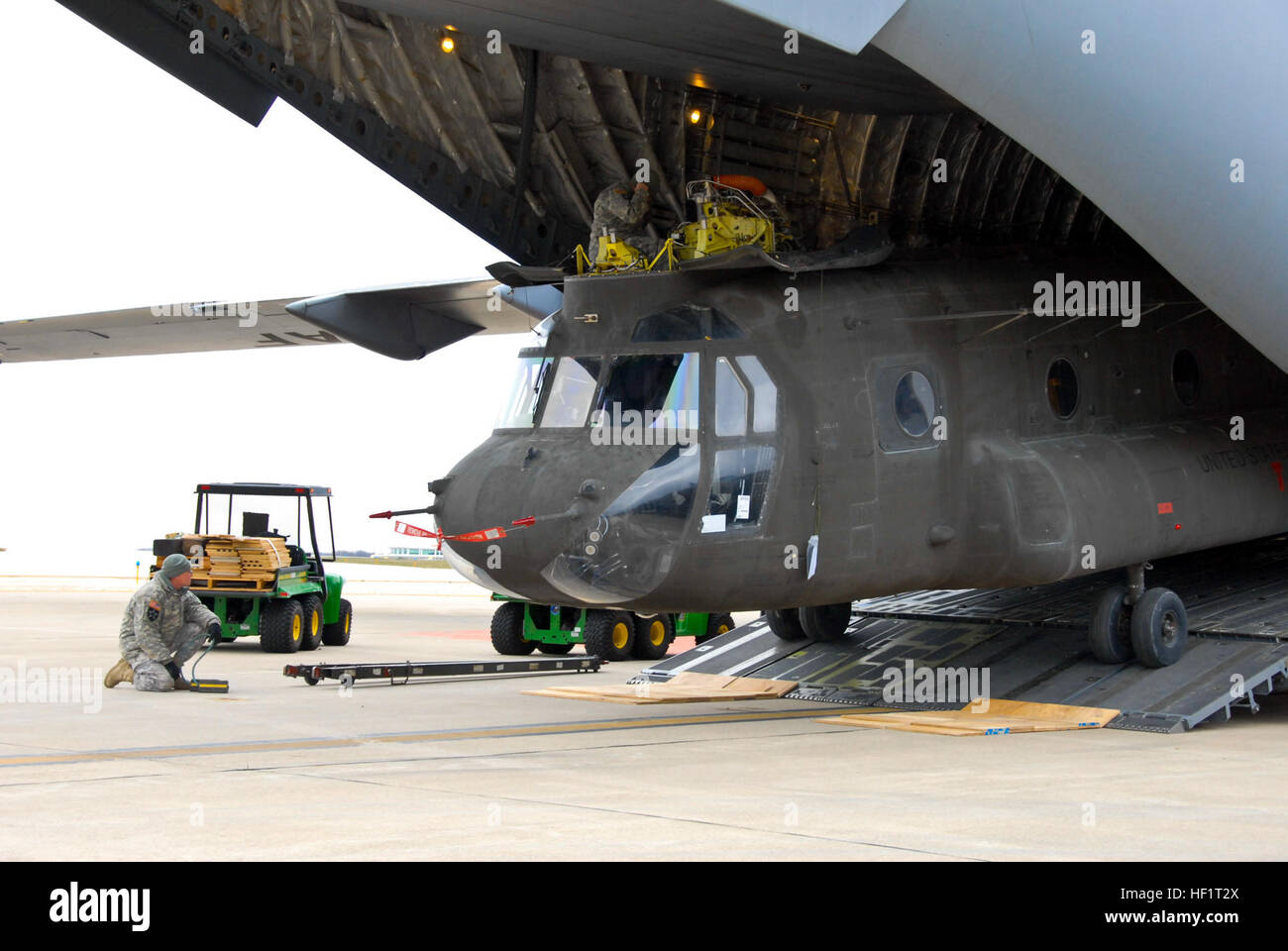 An Illinois Army National Guard CH-47 Chinook exits an Air Force C-17 ...