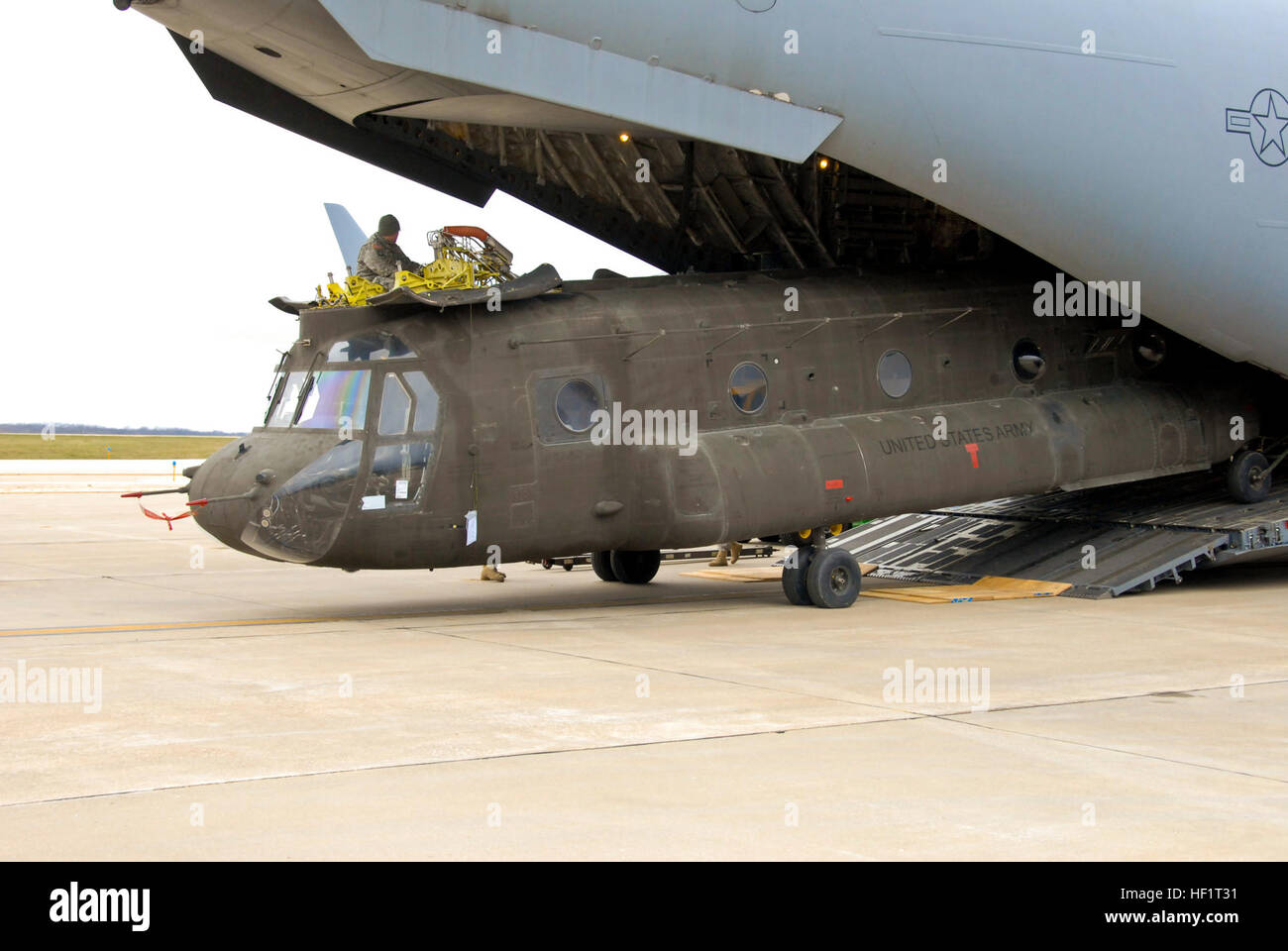 An Illinois Army National Guard CH-47 Chinook exits an Air Force C-17 ...