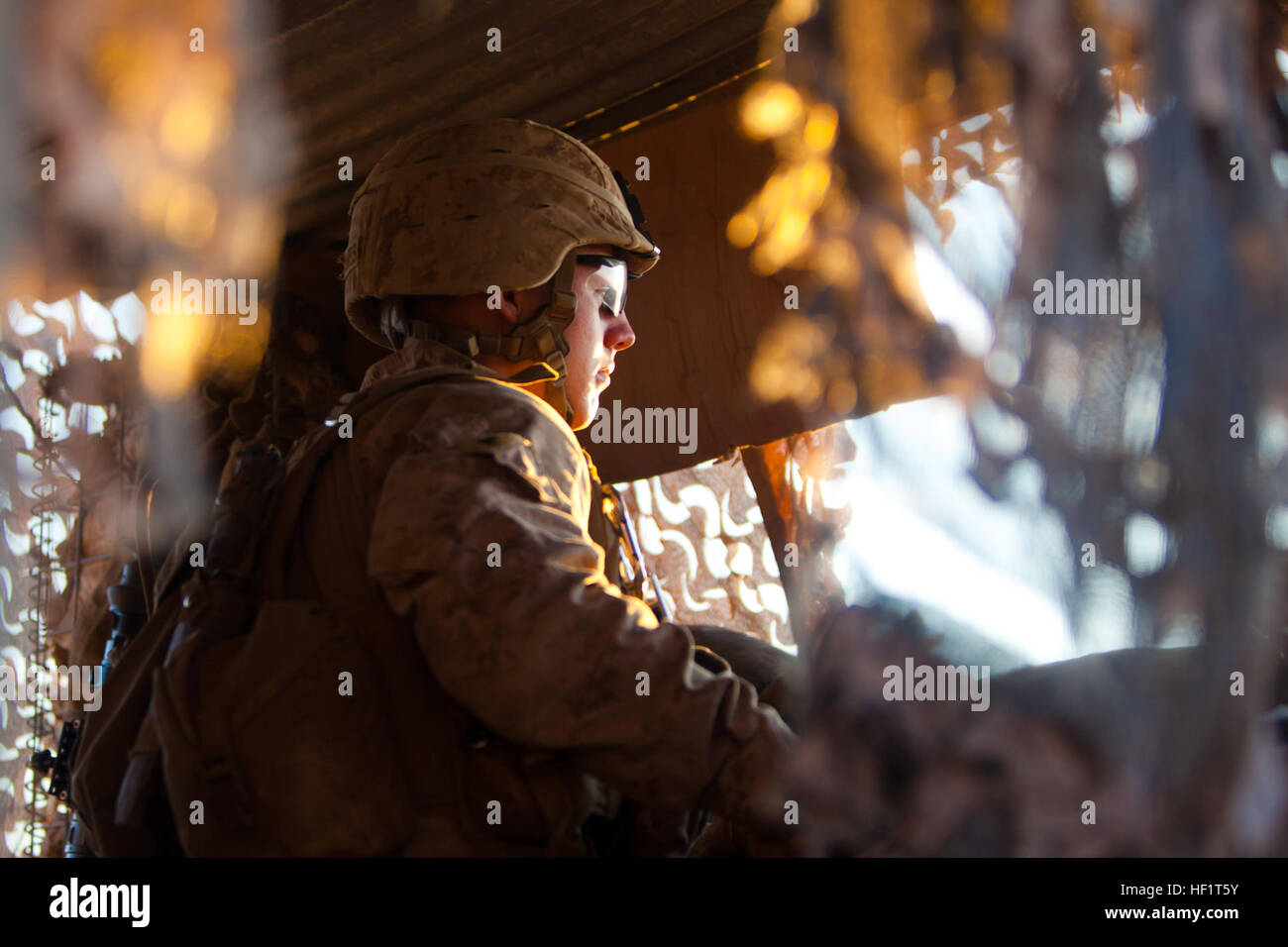 A Marine with 3rd Battalion, 7th Marines mans a guard post at ...
