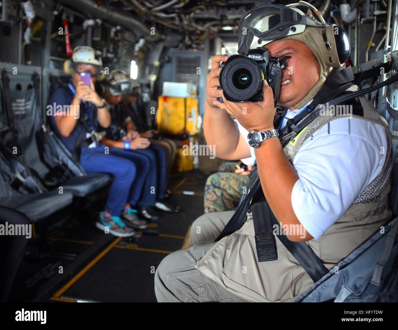 Brunei media photograph their first flight on a U.S. Marine Corps MV ...
