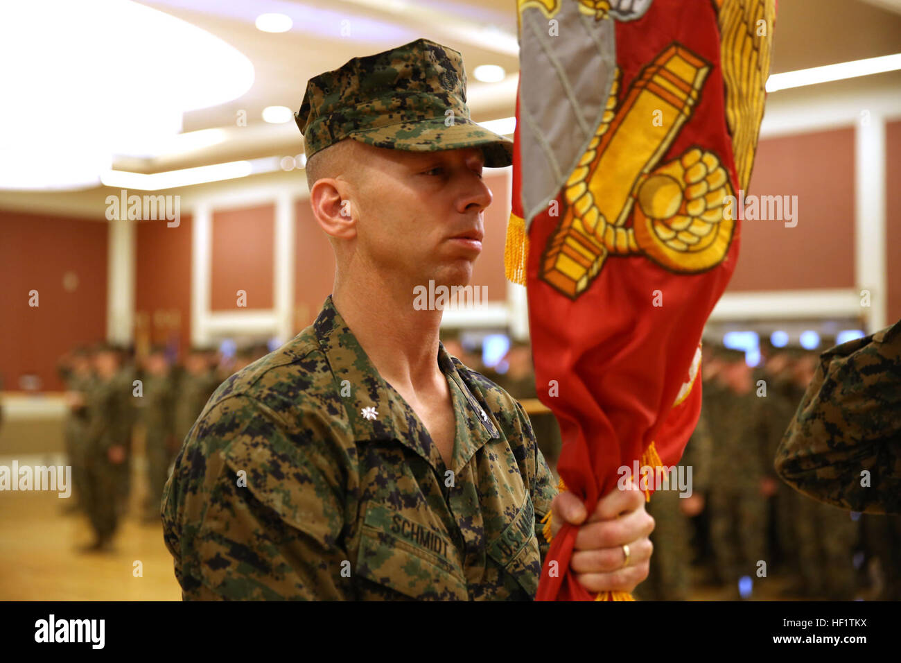 Lieutenant Col. Joel F. Schmidt receives the unit's colors, signifying ...