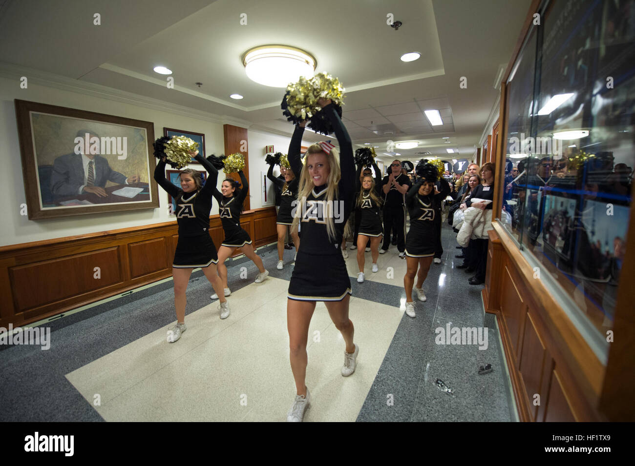 Cheerleaders lead a pep rally through the halls of the Pentagon ...