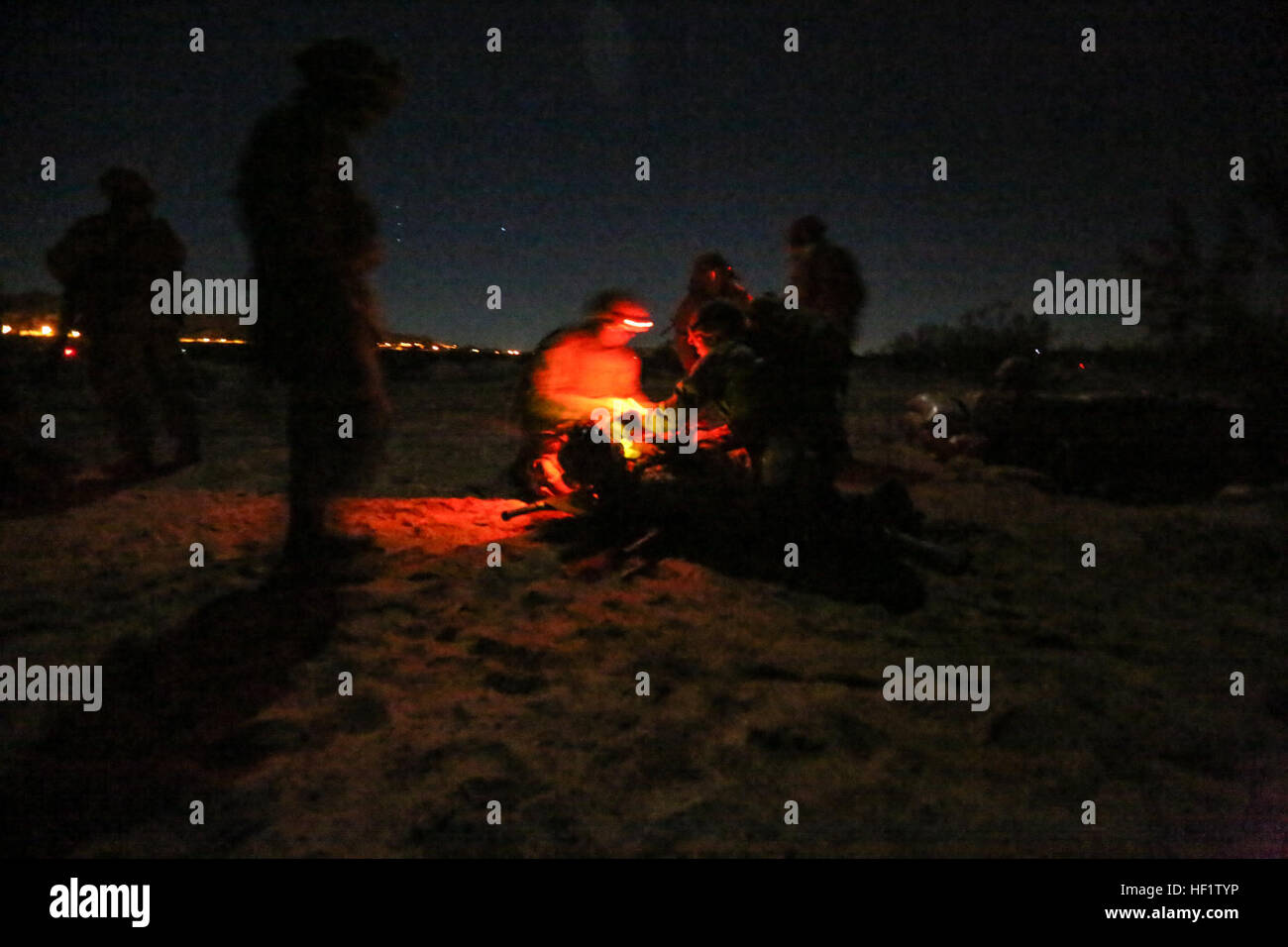 U.S. Navy Corpsmen perform initial battle wound assessments of a ...
