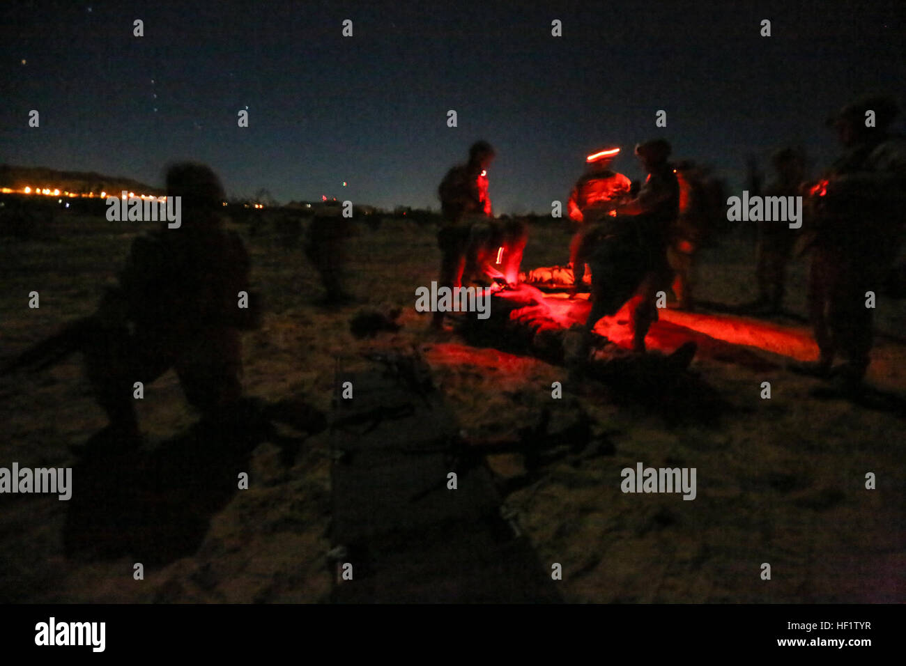 U.S. Navy Corpsmen perform initial battle wound assessments of a ...