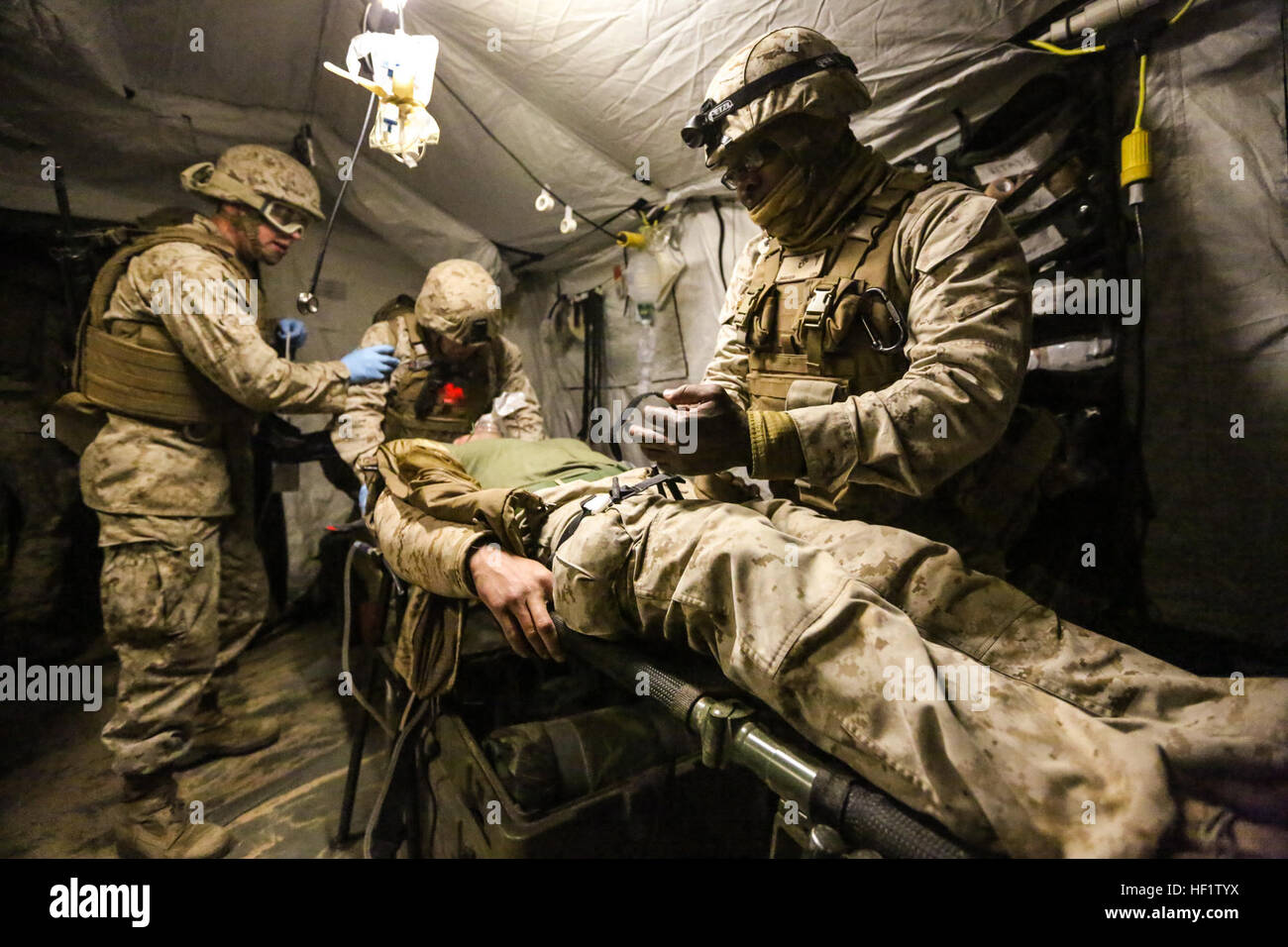 U.S. Navy HM1 Michael K. Phillips (left to right), HM3 Thomas J ...