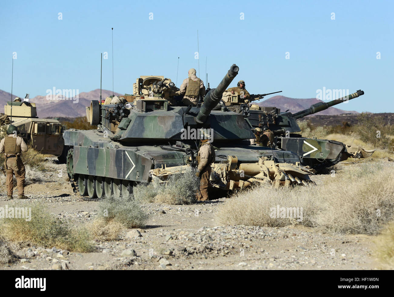 Marines with 1st Tank Battalion perform a final check on their M1A1 ...