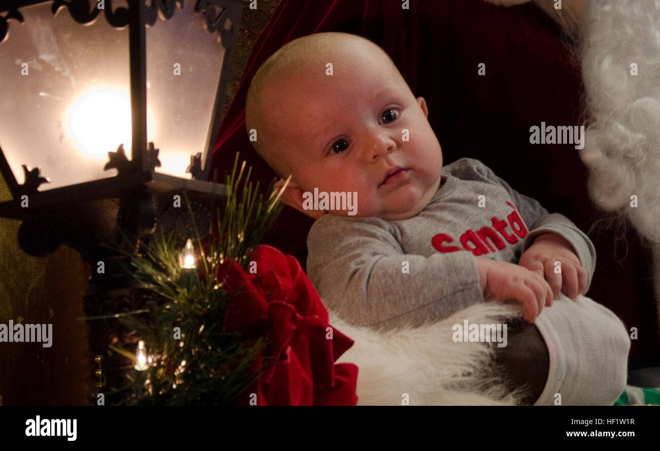 Three-month-old Jacob Daniels sits in Santa's lap for a picture during ...