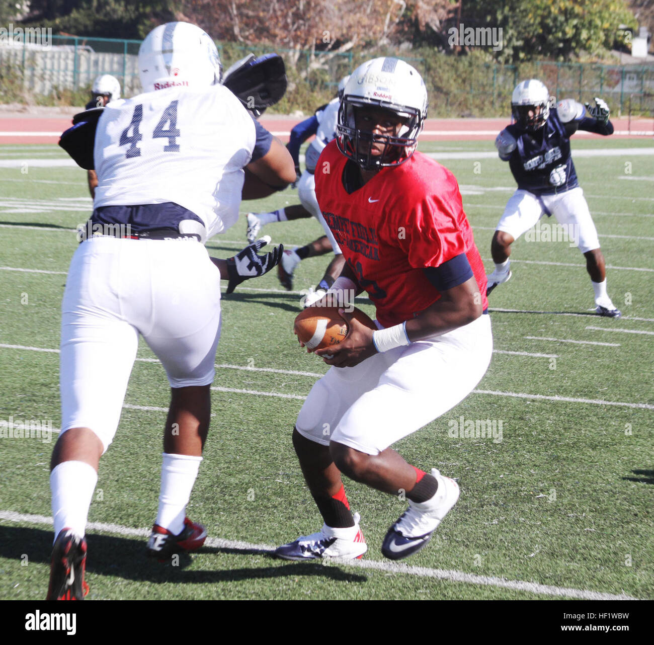 Quentin Gibson, a quarterback from Marrero, L.A., fakes the handoff to ...
