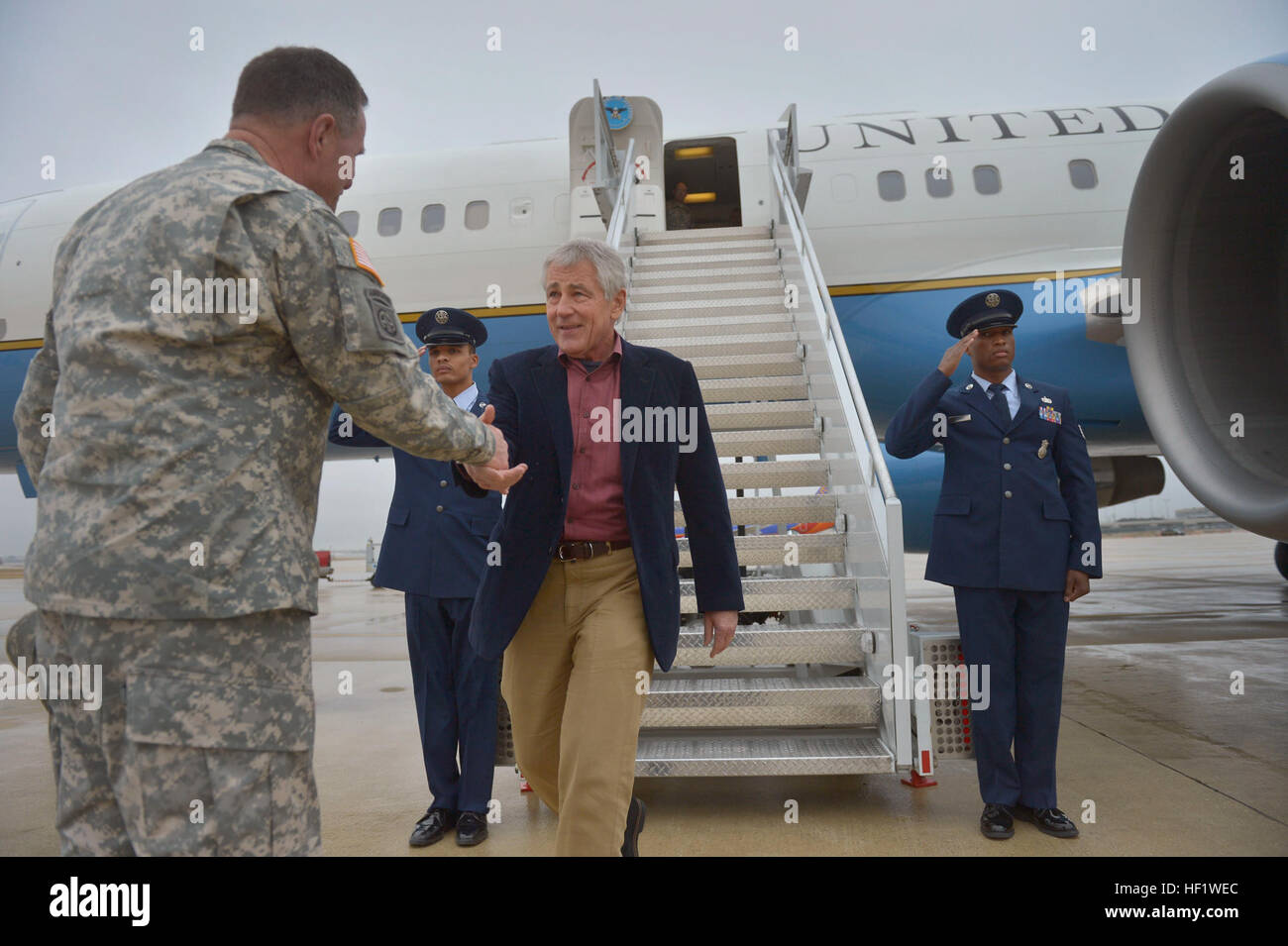 Secretary of Defense Chuck Hagel, center, is greeted by U.S. Army Lt ...