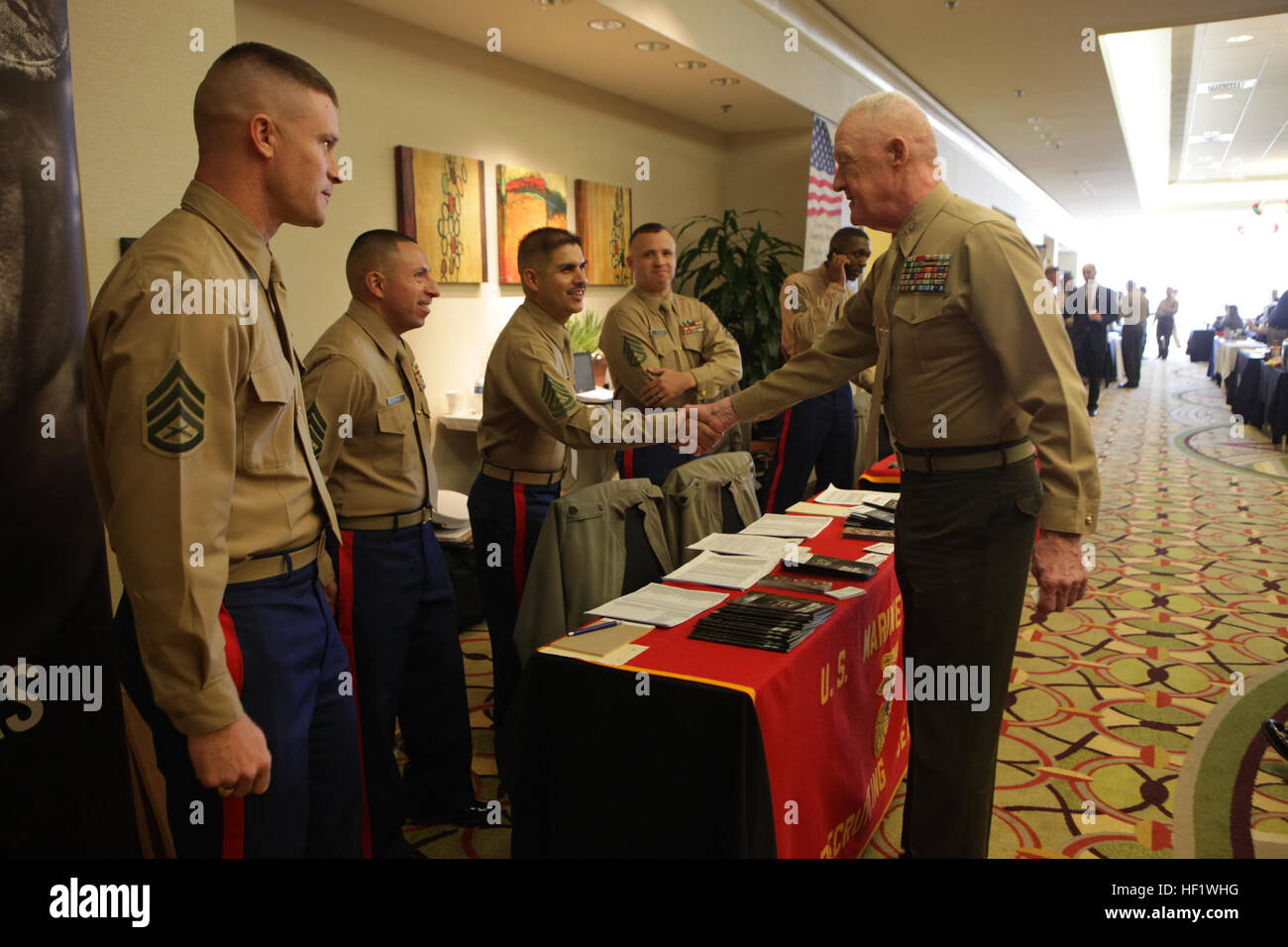 Prior-service recruiters shake hands with Lt. Gen. Richard P. Mills ...