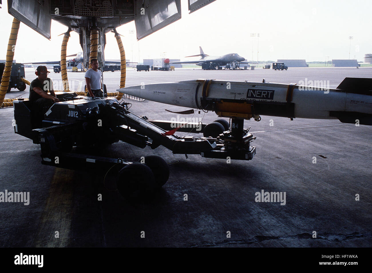 Members of the 96th Munitions Maintenance Squadron use a weapons loader ...