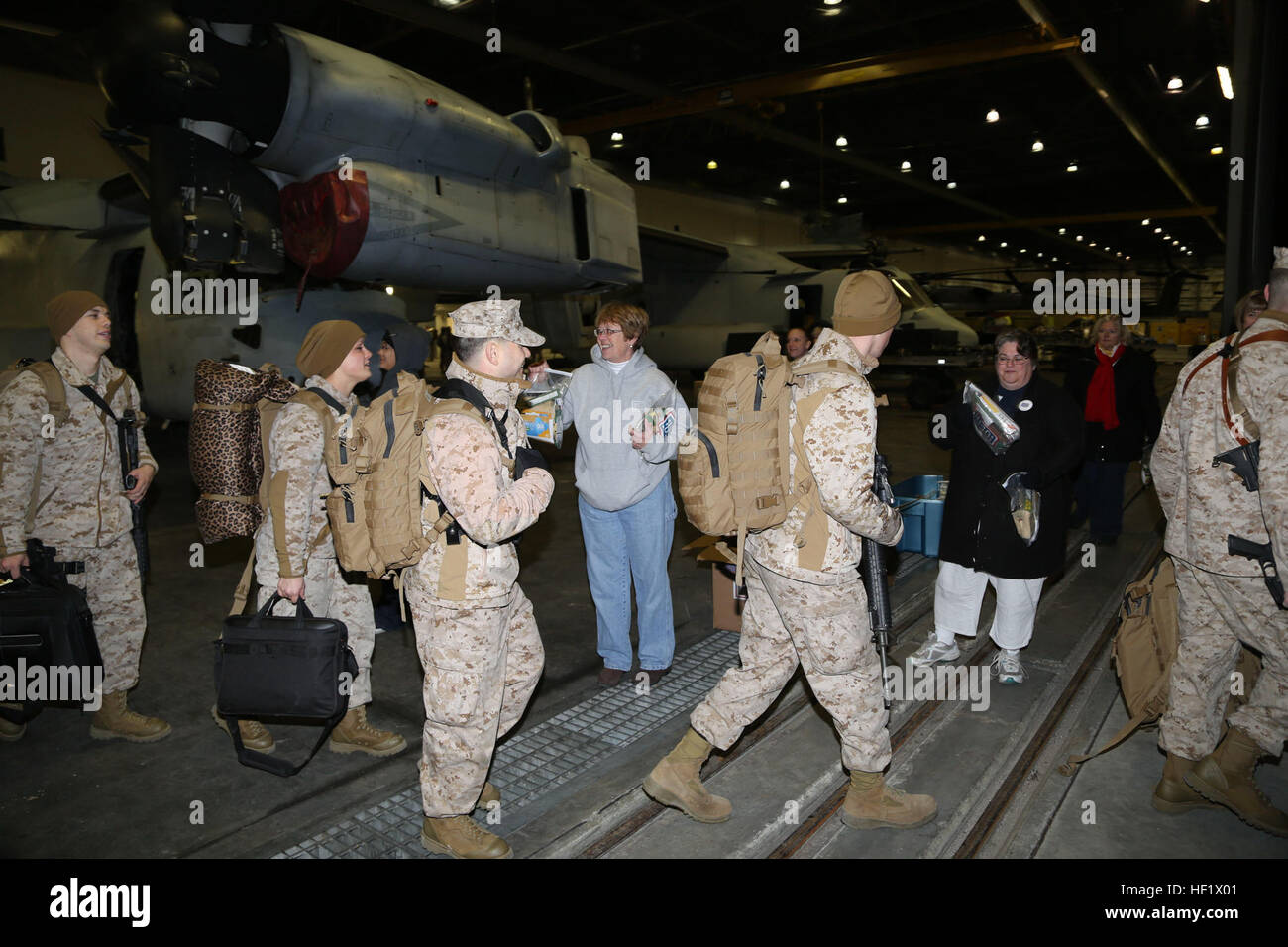 U.S. Marines from Marine Medium Tiltrotor Squadron (VMM) 261 receive ...