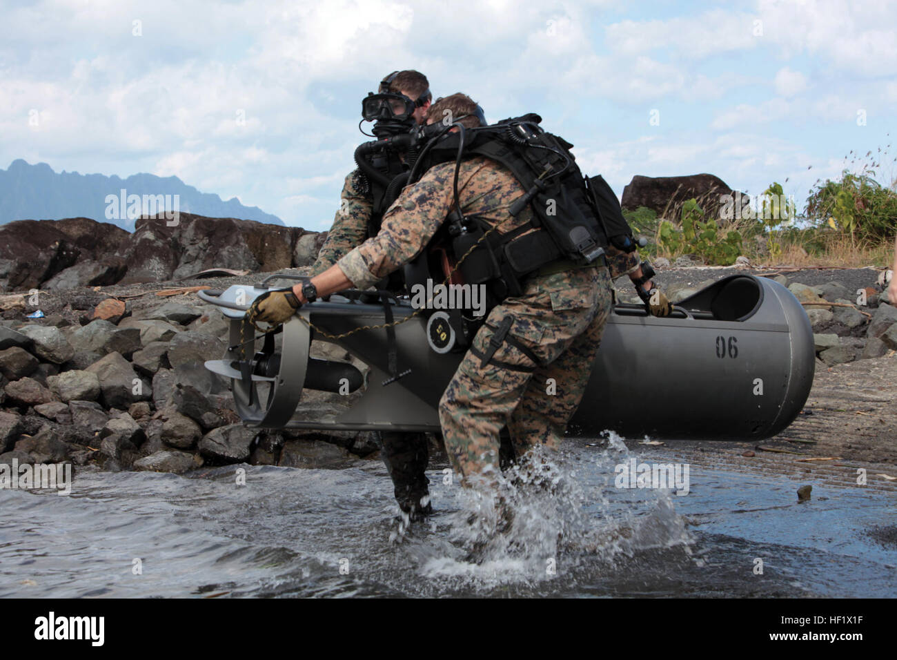 Cpl. Peter E. Kober, left, and Sgt. Scott A. Hulsizer carry their diver ...